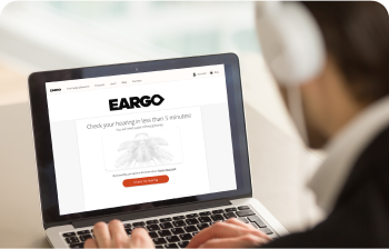 Image of an Eargo user taking Eargo's free hearing screening from the ...